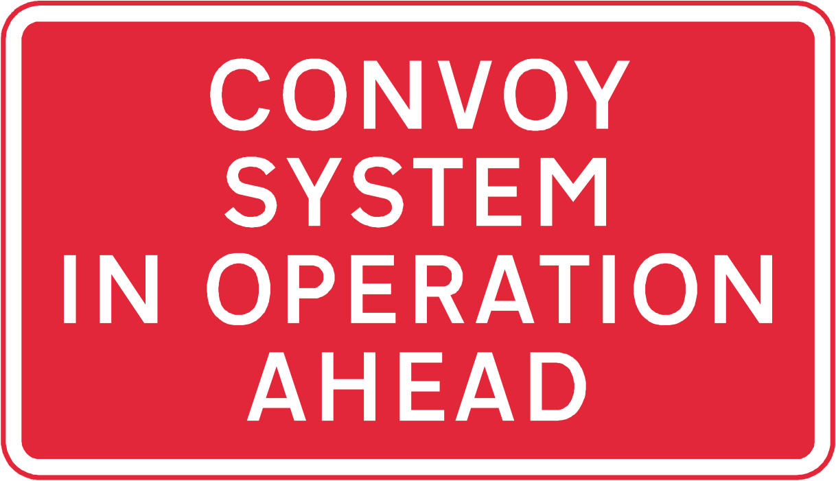 Vehicles to be escorted in convoys through road works ahead sign - UK ...
