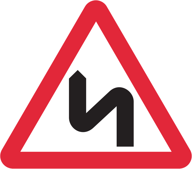 Double bend first to the left sign - UK Road Sign